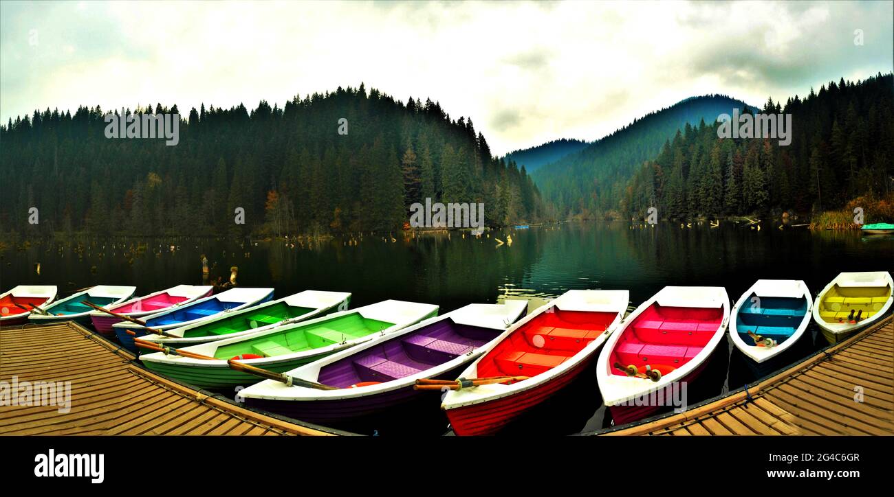 A breathtaking view of a mountain lake and forest with multicolor empty ...