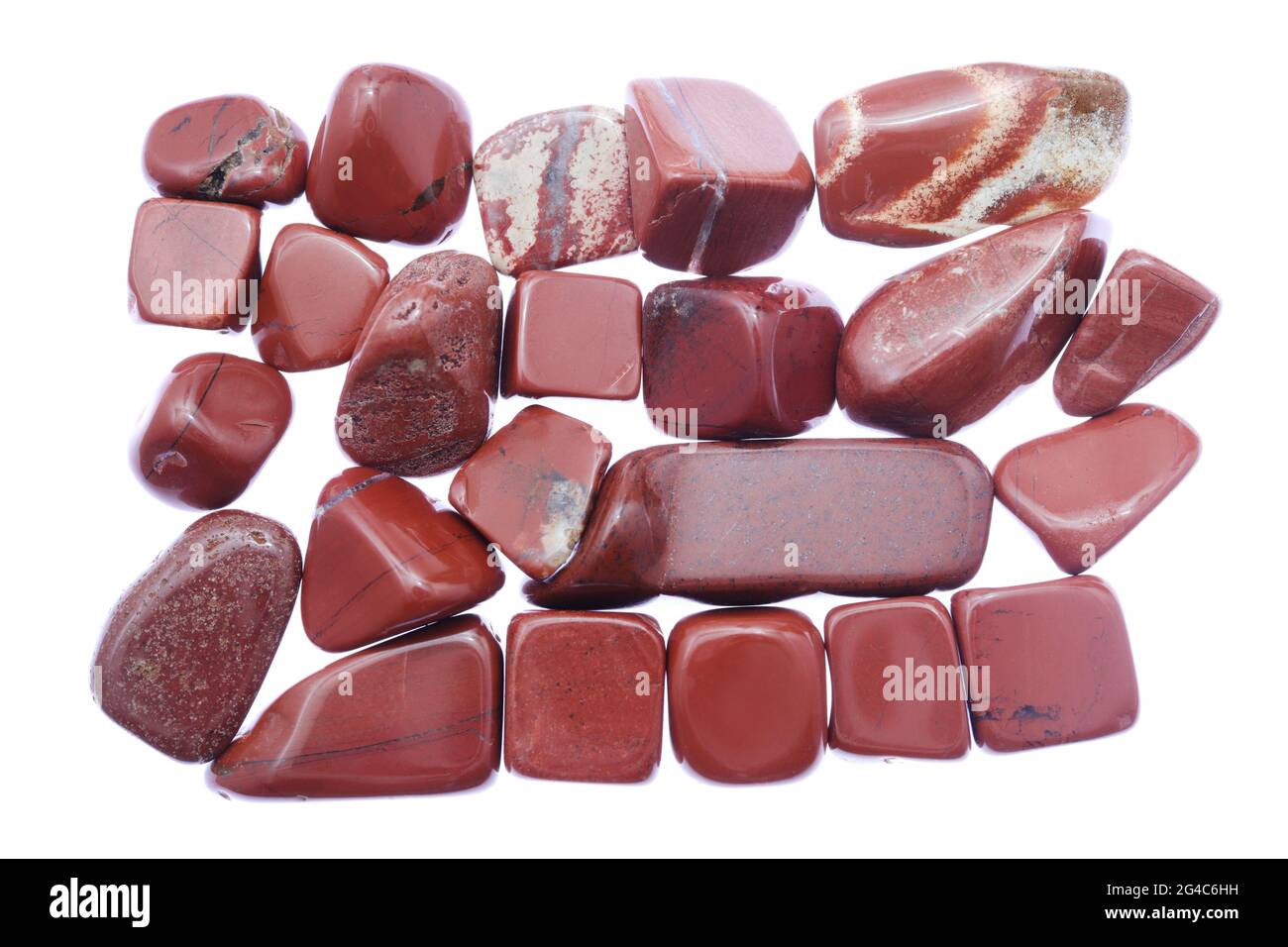 Red jasper heap jewel stones texture on white light background Stock ...