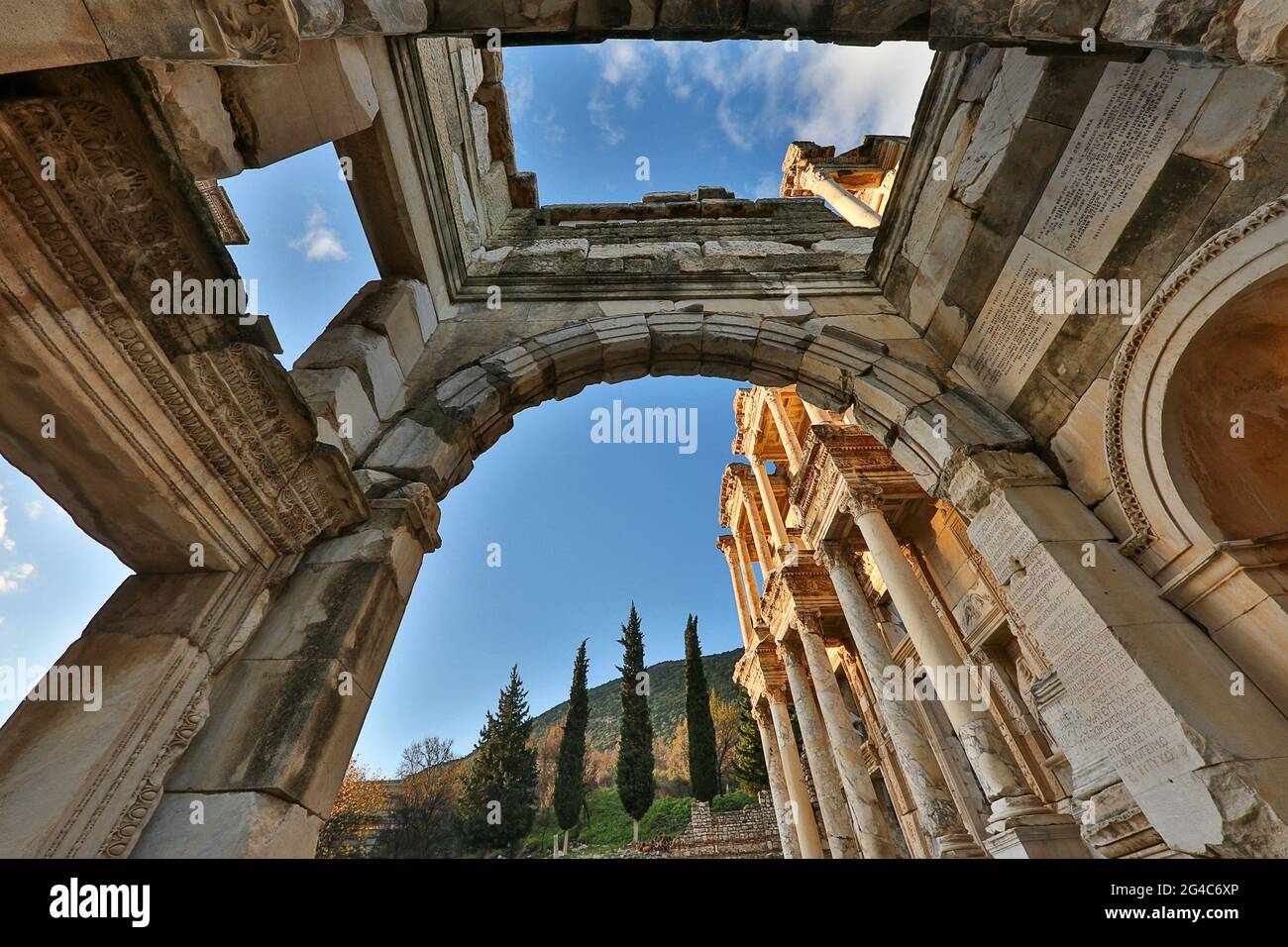 Celsus Library through arches in the Roman ruins of Ephesus in Turkey ...
