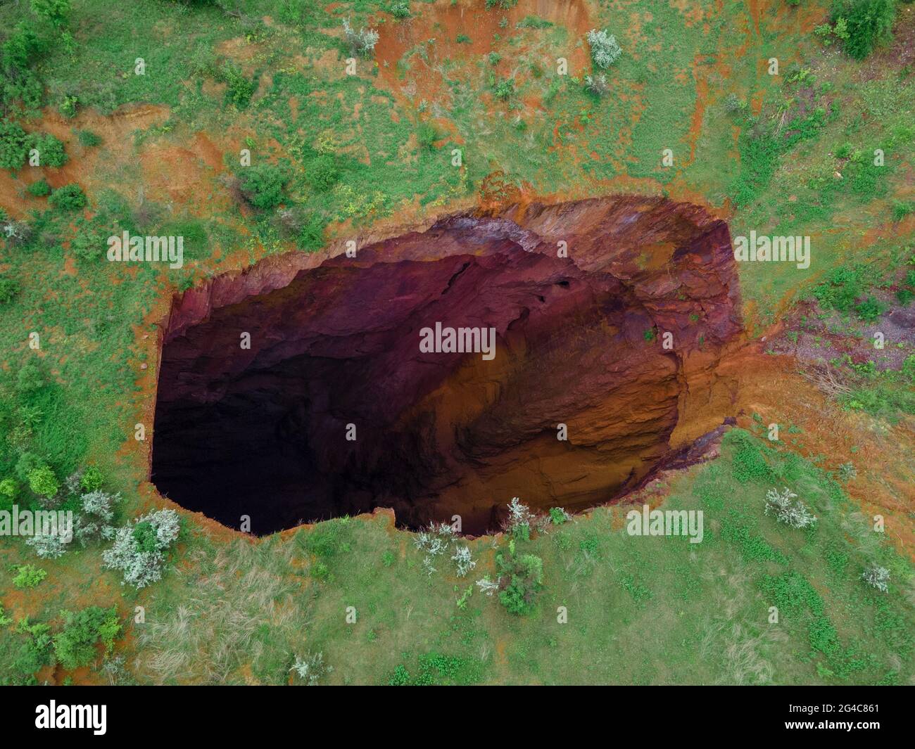 overhead view of collapsed mine big hole in land Stock Photo - Alamy