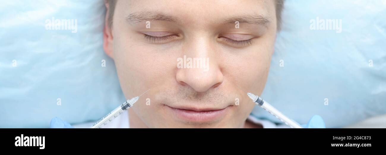 Male patient is given multiple injections into facial skin Stock Photo ...