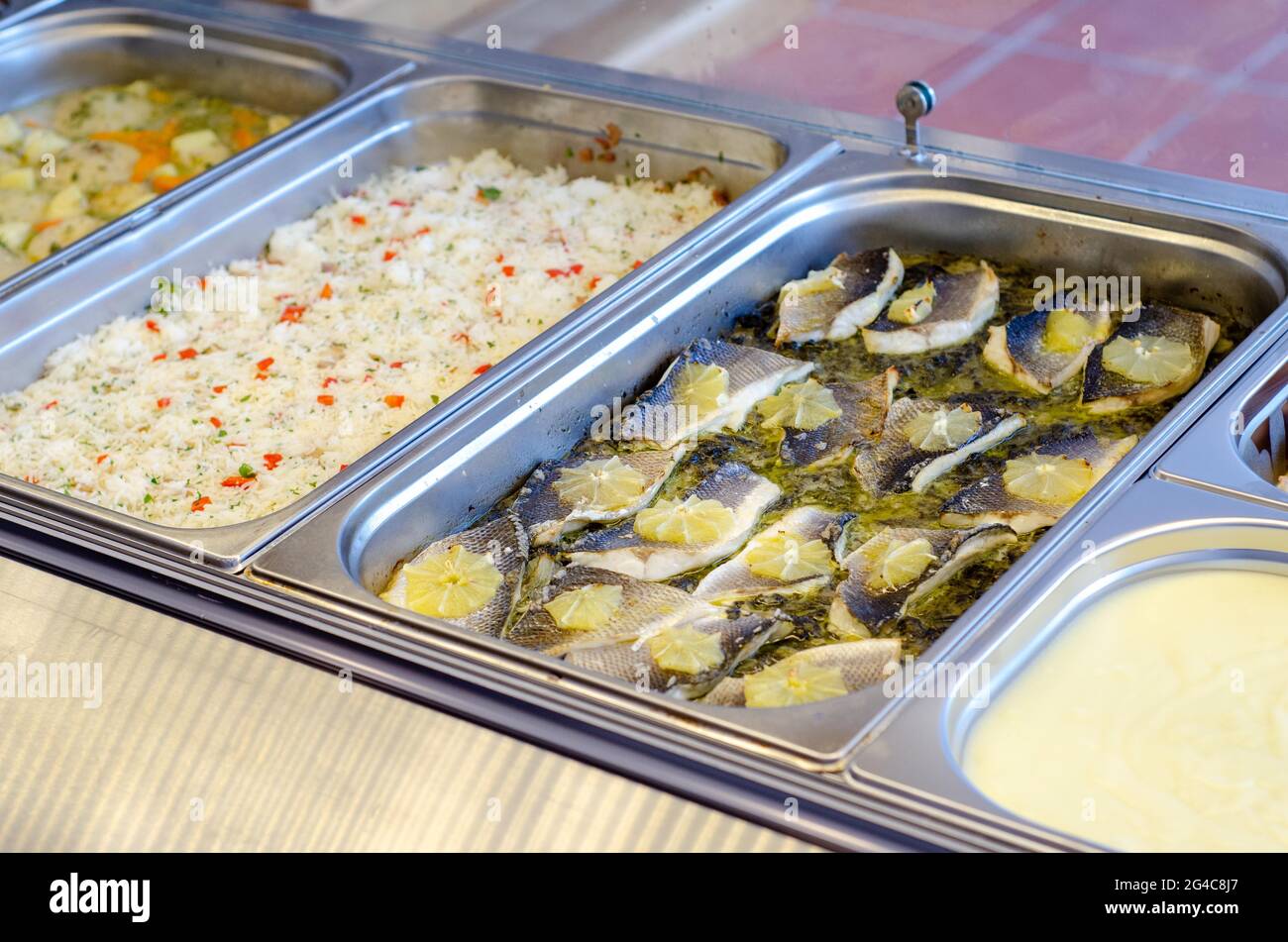 A soft focus of various dishes in a food display counter at a buffet ...