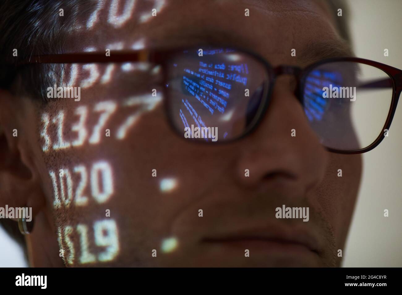 Computer code reflecting in eyeglasses hi-res stock photography and images - Alamy