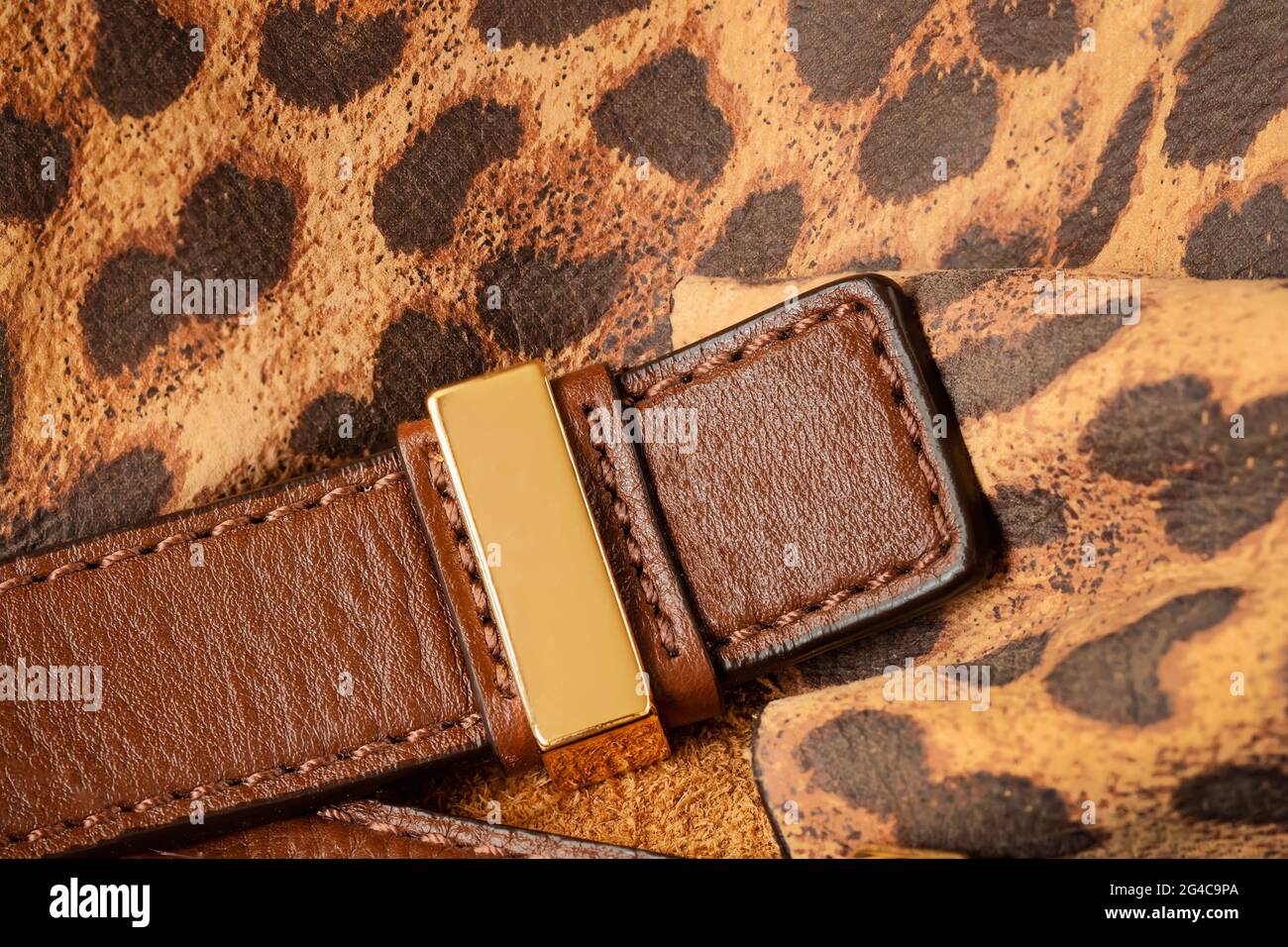 Detail of leather handbag, bright color of exotic skin of leopard ...