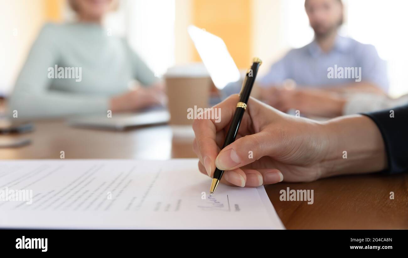 Woman signing contract close up hands hi-res stock photography and ...