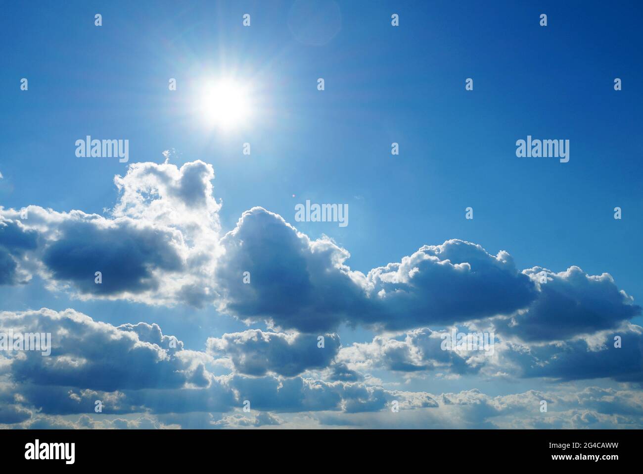 clear sun in the sky above rain clouds Stock Photo - Alamy