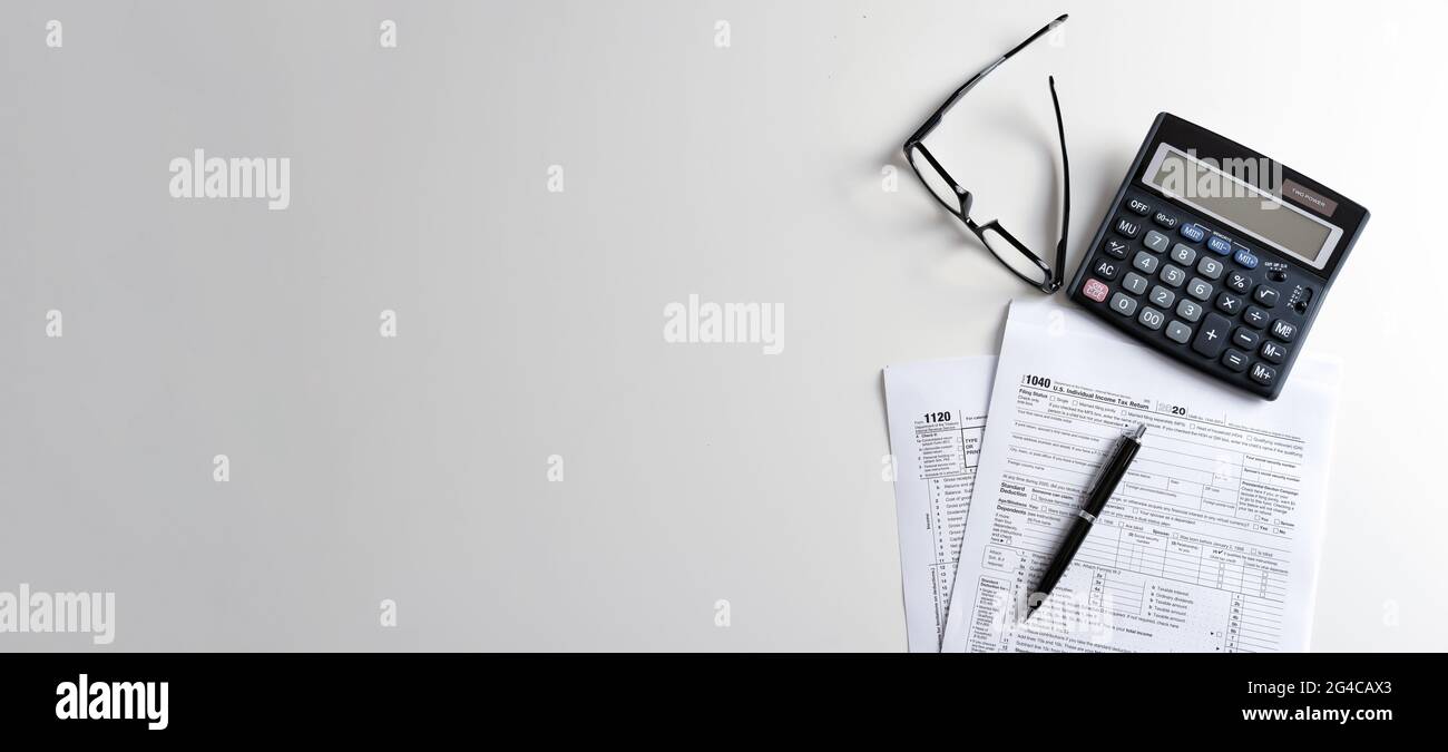 US Individual income tax return. US tax forms on desk. Wide image with ...