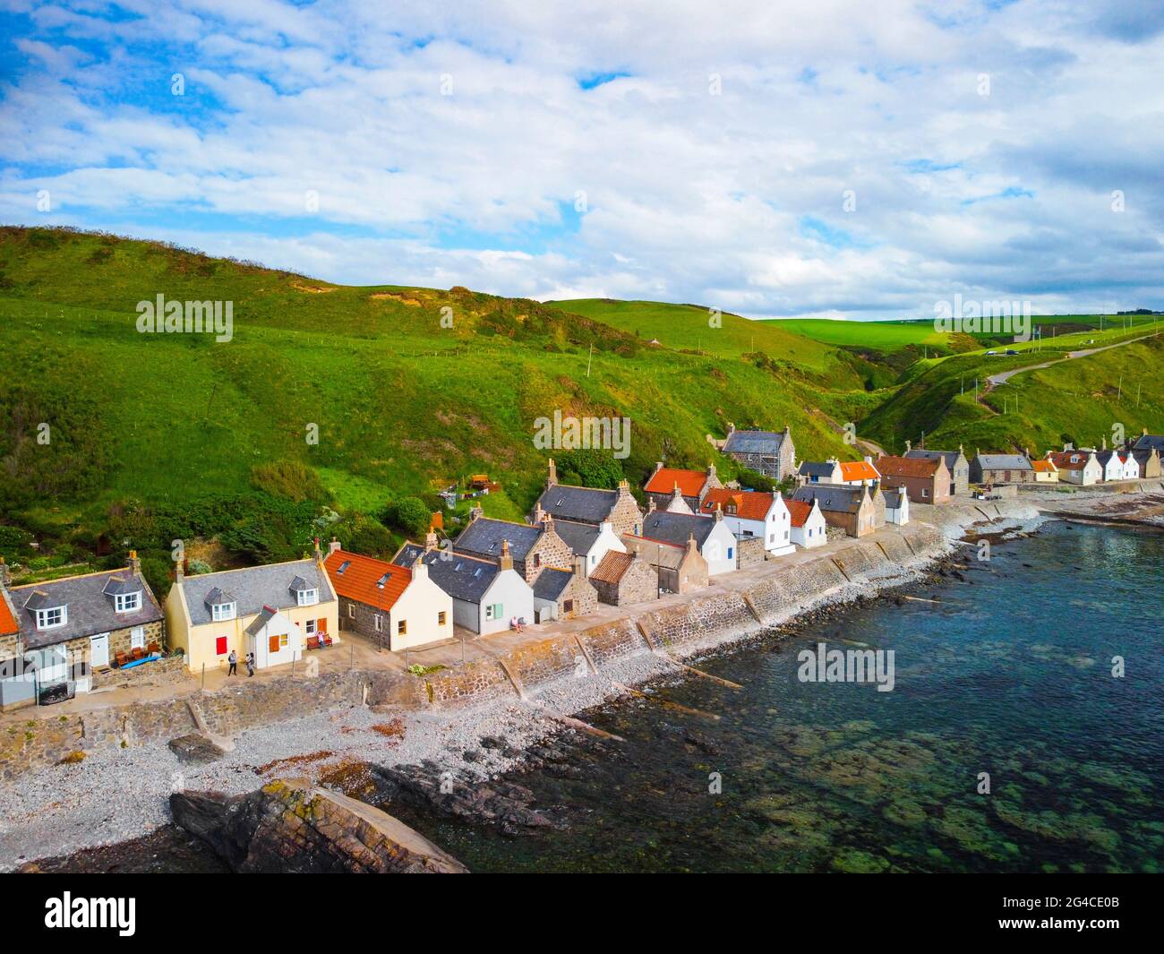 Aerial view from drone of houses in village of Crovie on Moray Firth ...