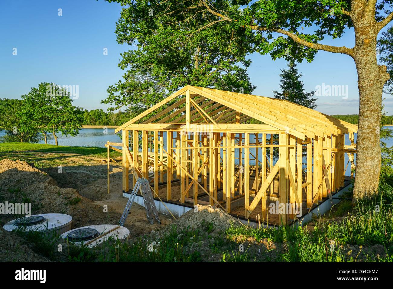 construction of a simple wooden recreation building on the lake shore ...