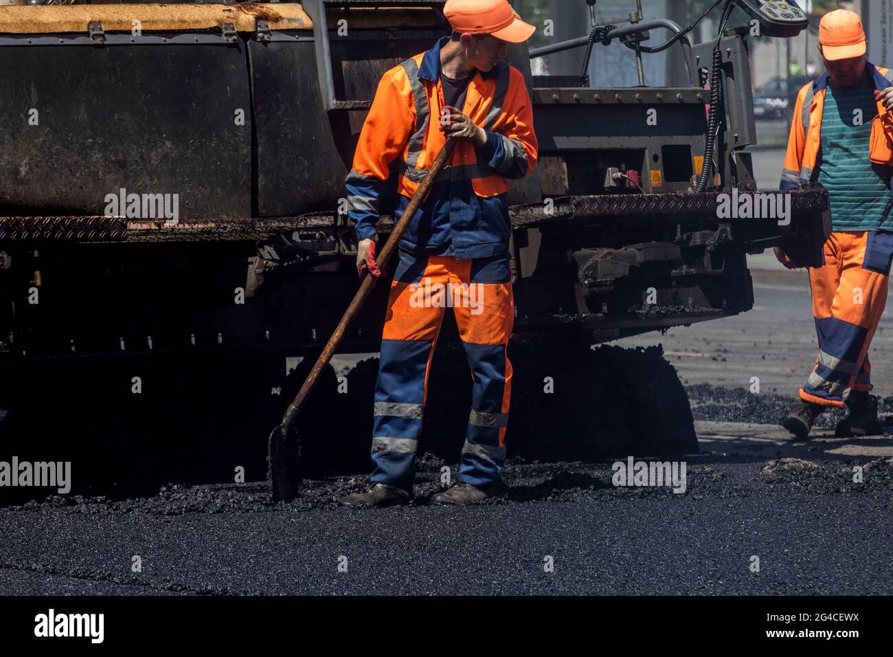 Moscow, Russia. 20th of June, 2021 Road workers are laying a new ...