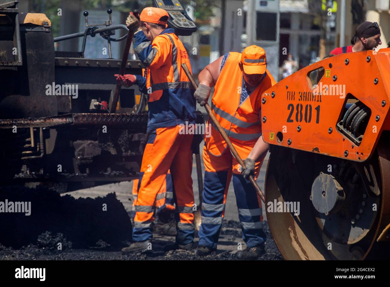 Moscow, Russia. 20th of June, 2021 Road workers are laying a new ...