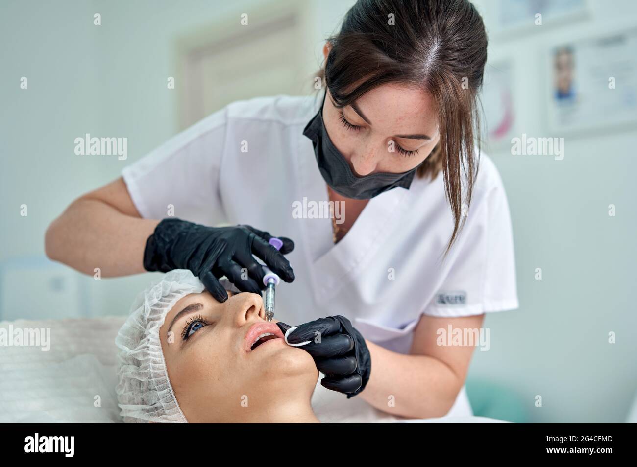 A patient with closed eyes lies in the doctor's office. Face of the ...