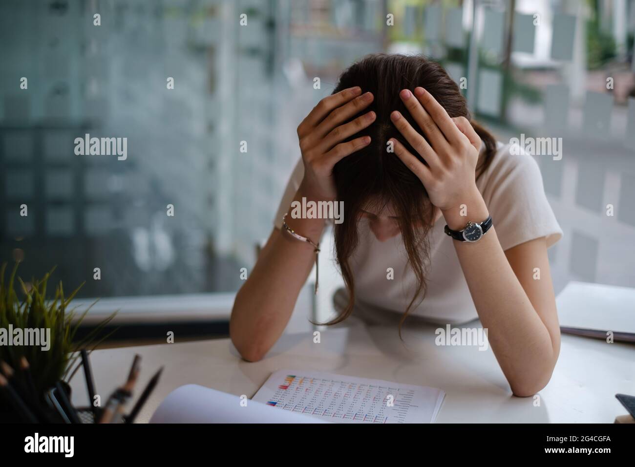 Frustrated stressed business owner or accountant sitting in an office ...