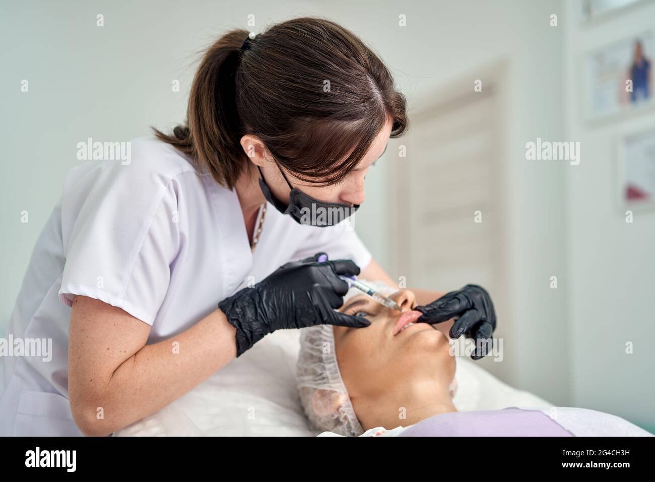 A patient with closed eyes lies in the doctor's office. Face of the ...