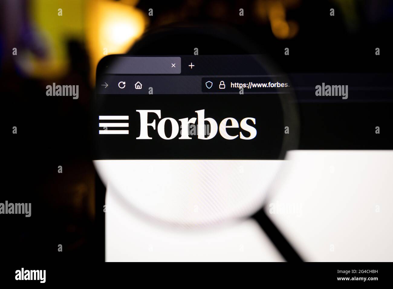 Forbes company logo on a website, seen on a computer screen through a ...