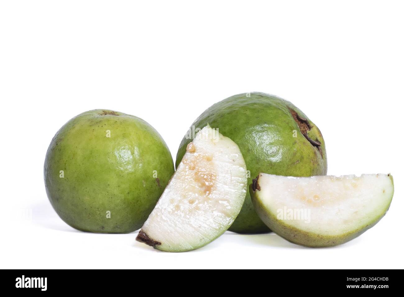 A full and sliced fresh, green guavas with a white background Stock ...