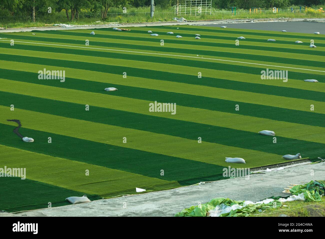 Restoration of a football field, green turf for sporting events Stock ...