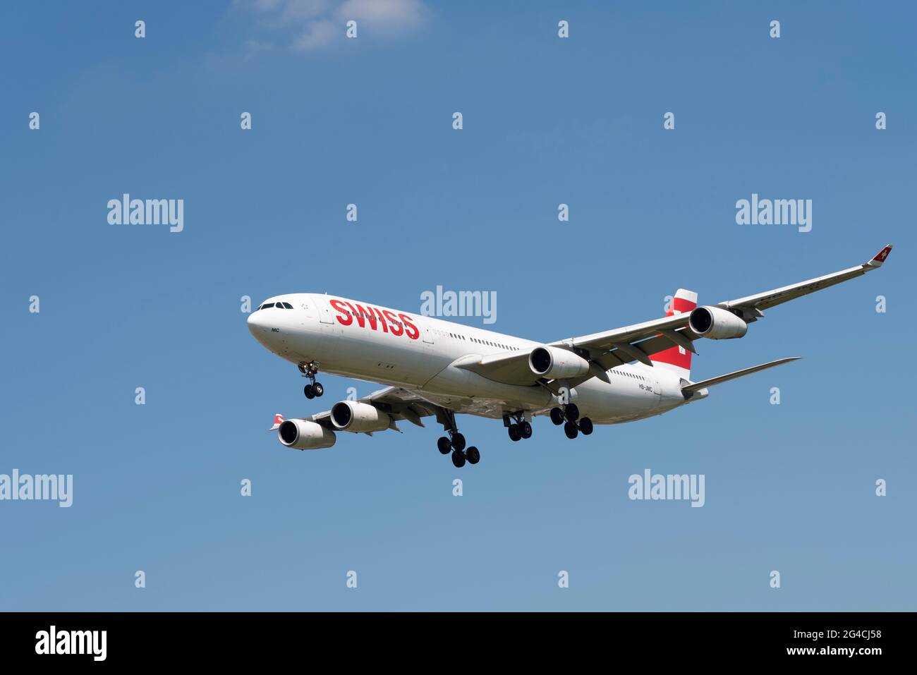 Swiss Airbus A340 airliner jet plane HB-JMC coming in on finals to land ...