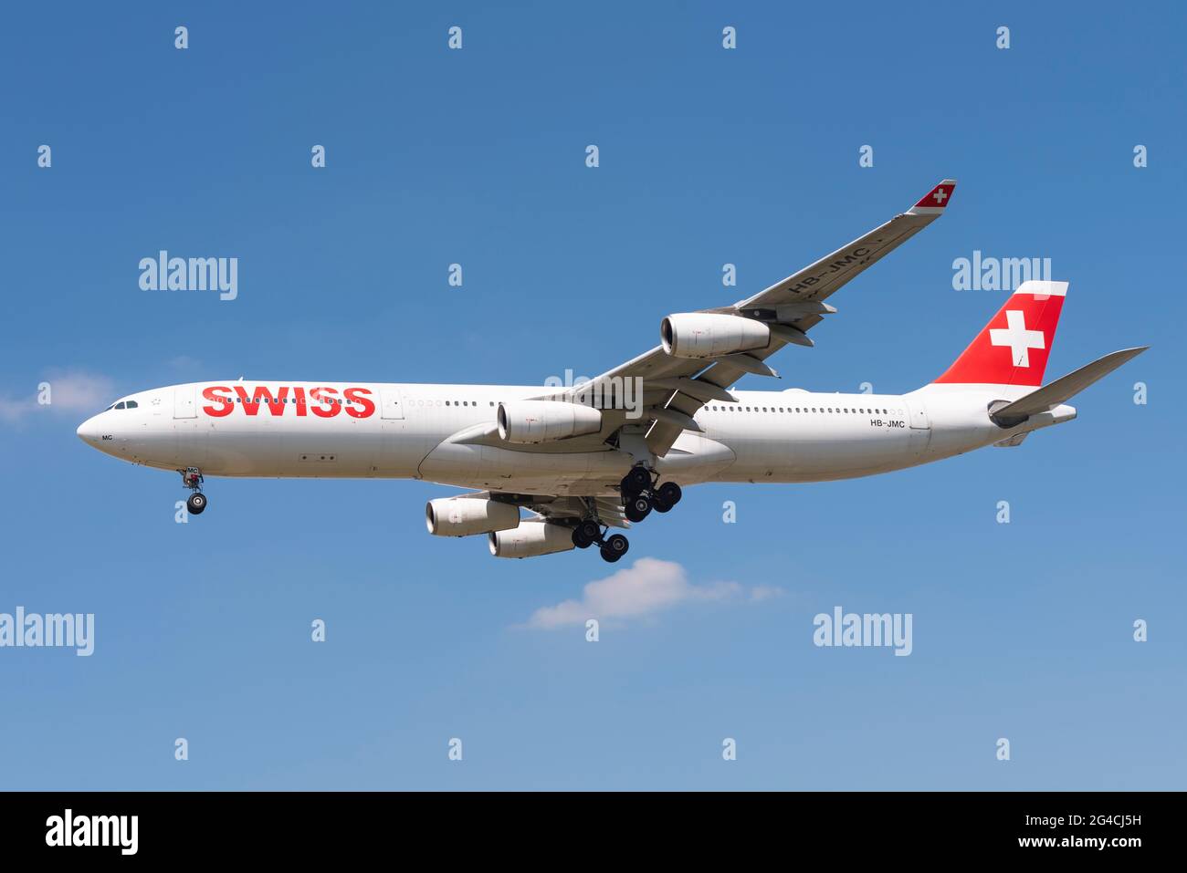 Swiss Airbus A340 airliner jet plane HB-JMC coming in on finals to land ...