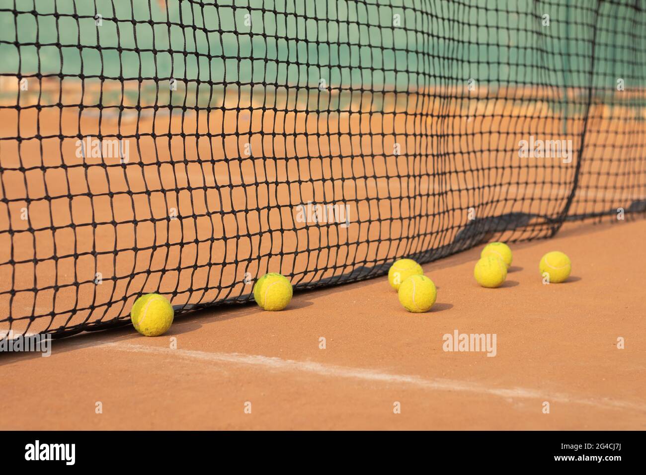 A closeup shot of tennis balls on the tennis court Stock Photo - Alamy