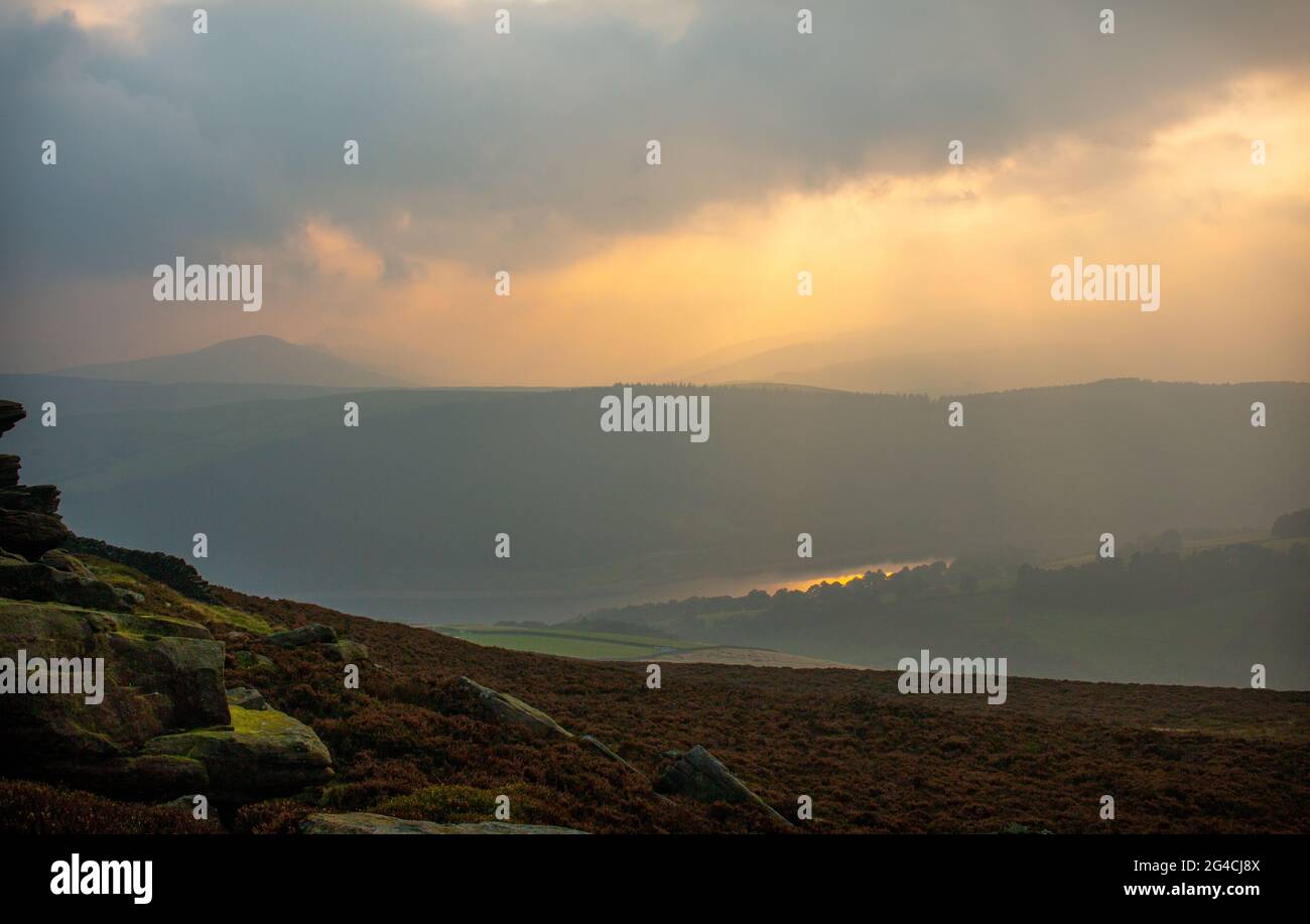 Ladybower water reserve in the evening fog at sunset, hiking trail in ...