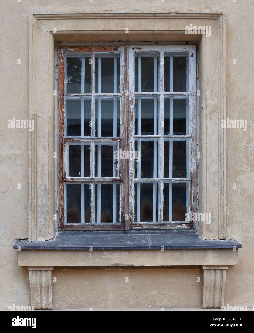 Old and beautiful antique, damaged window. Sophisticated facade, detail ...