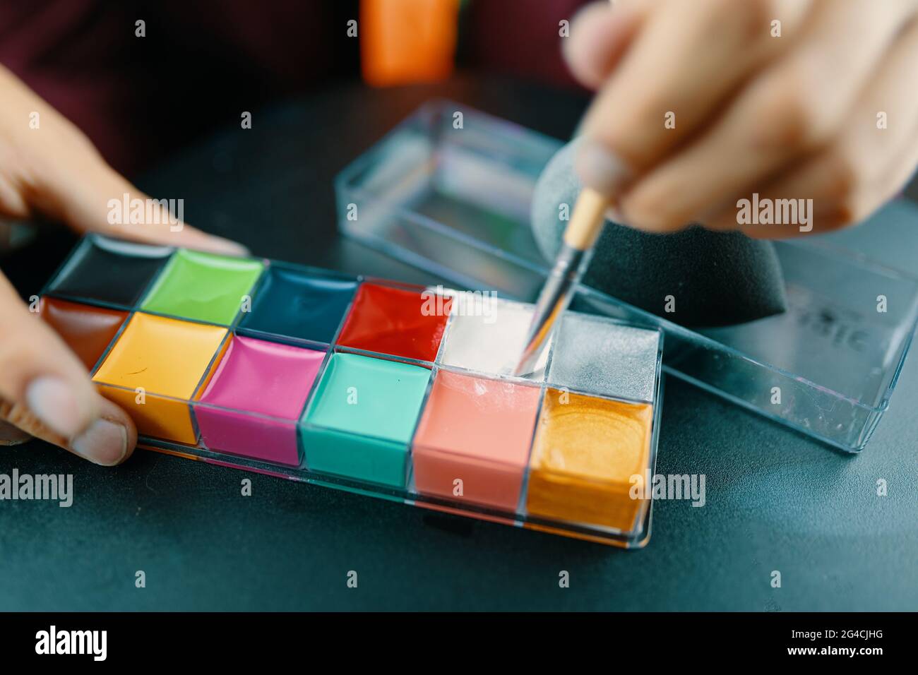 Makeup paints for face painting. The process of choosing paints with a ...