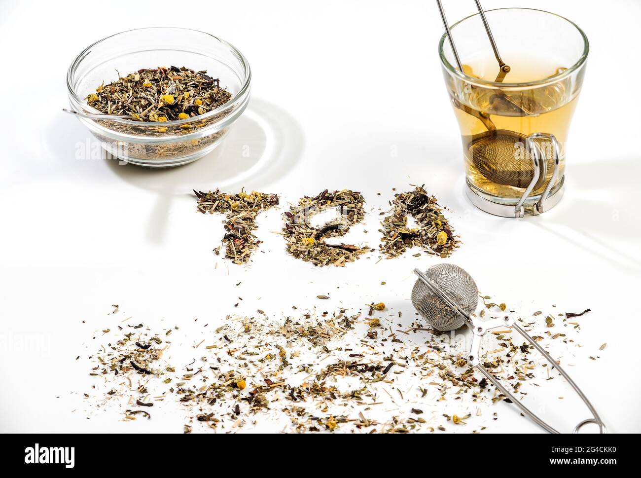 Tea text made by tea leaf on wwhite background surface with a bowl of ...
