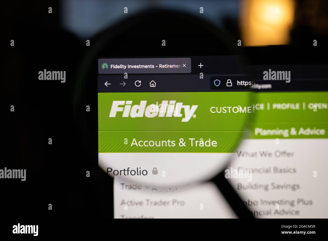 Fidelity company logo on a website, seen on a computer screen through a ...