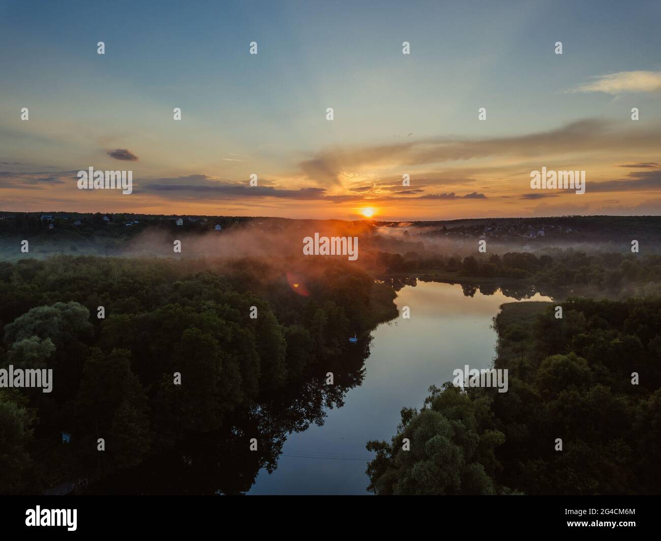 Sunset above the river in natural rural landscape Stock Photo - Alamy