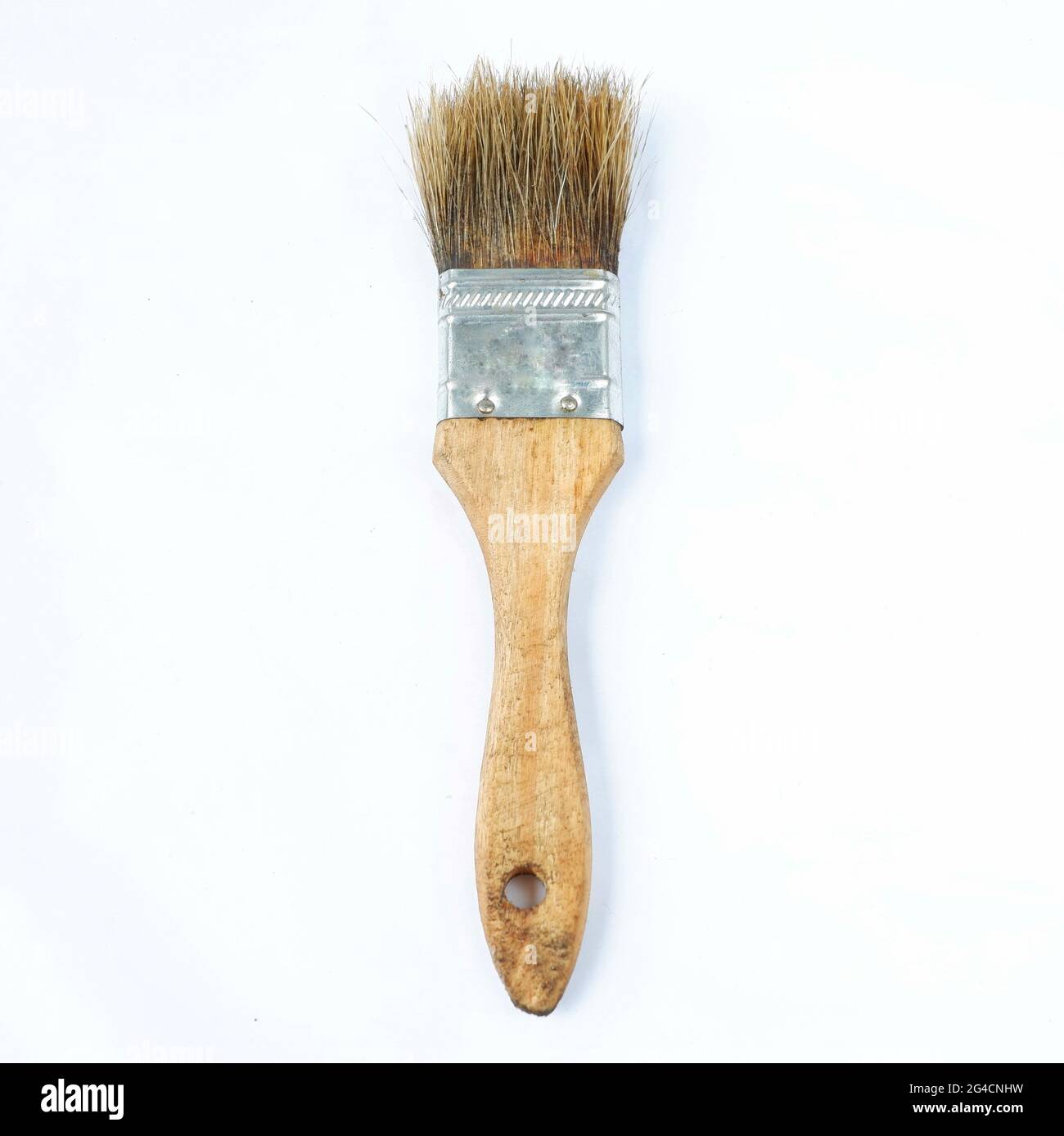 An old brush with a wooden handle isolated on a white background Stock ...