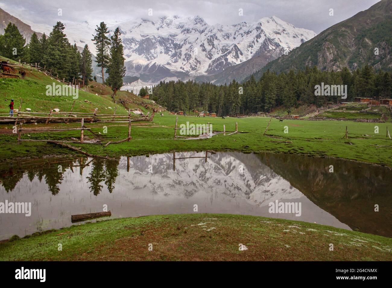 A beautiful landscape with a lake and snowy mountains in northern areas ...