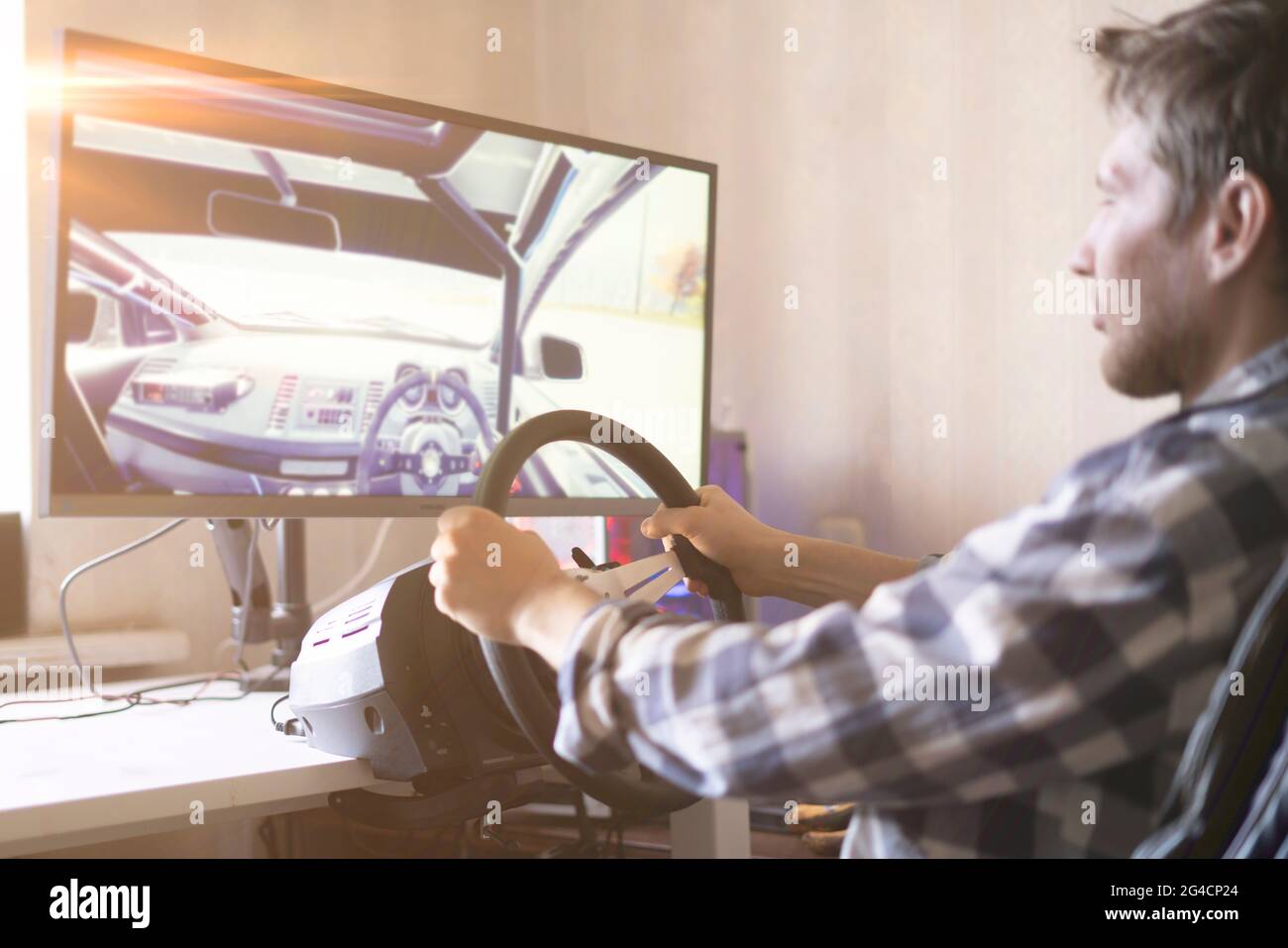 person learns how to drive the car using an auto computer simulator ...