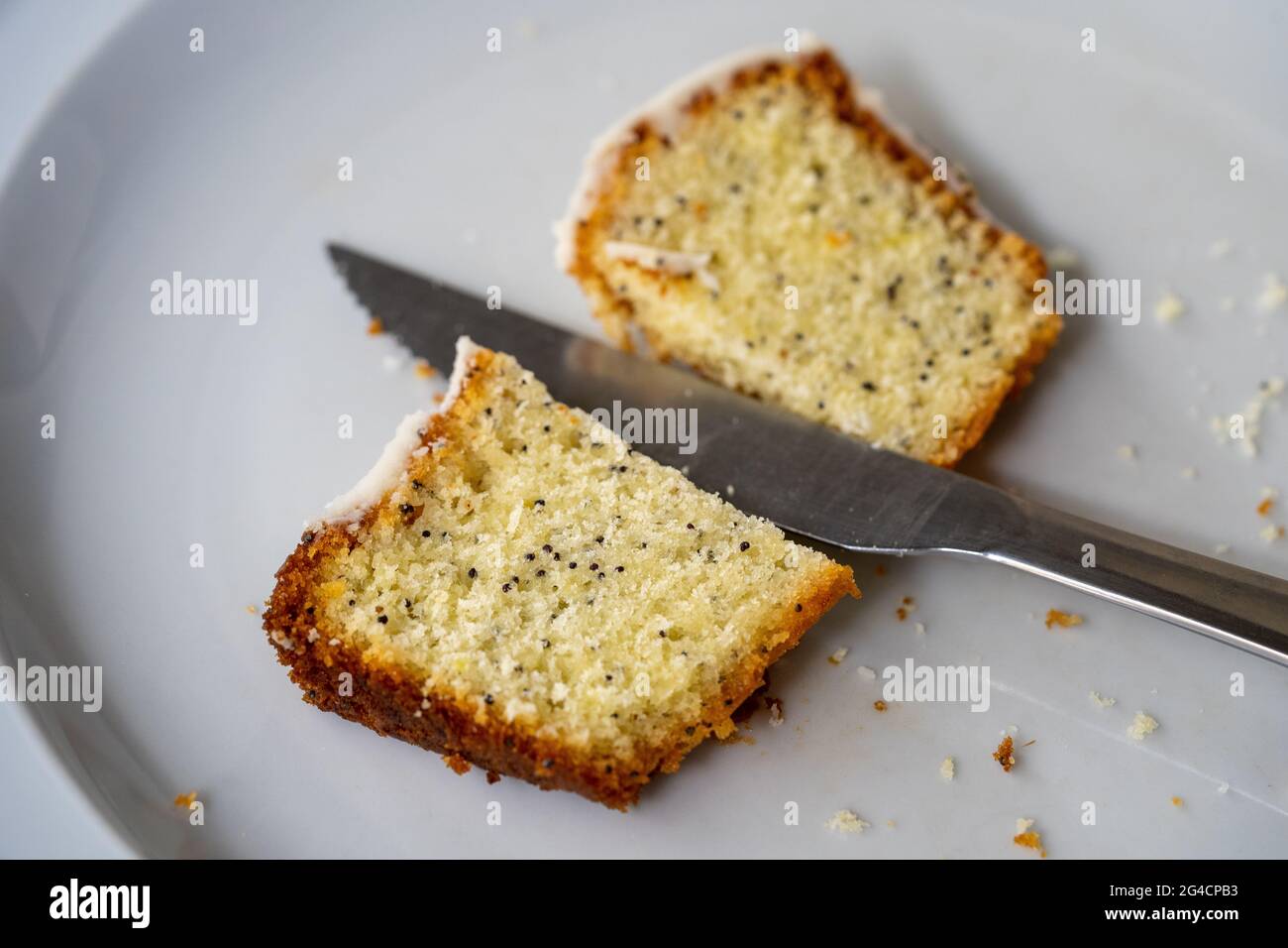 The closeup of knife cutting biscuit Stock Photo - Alamy