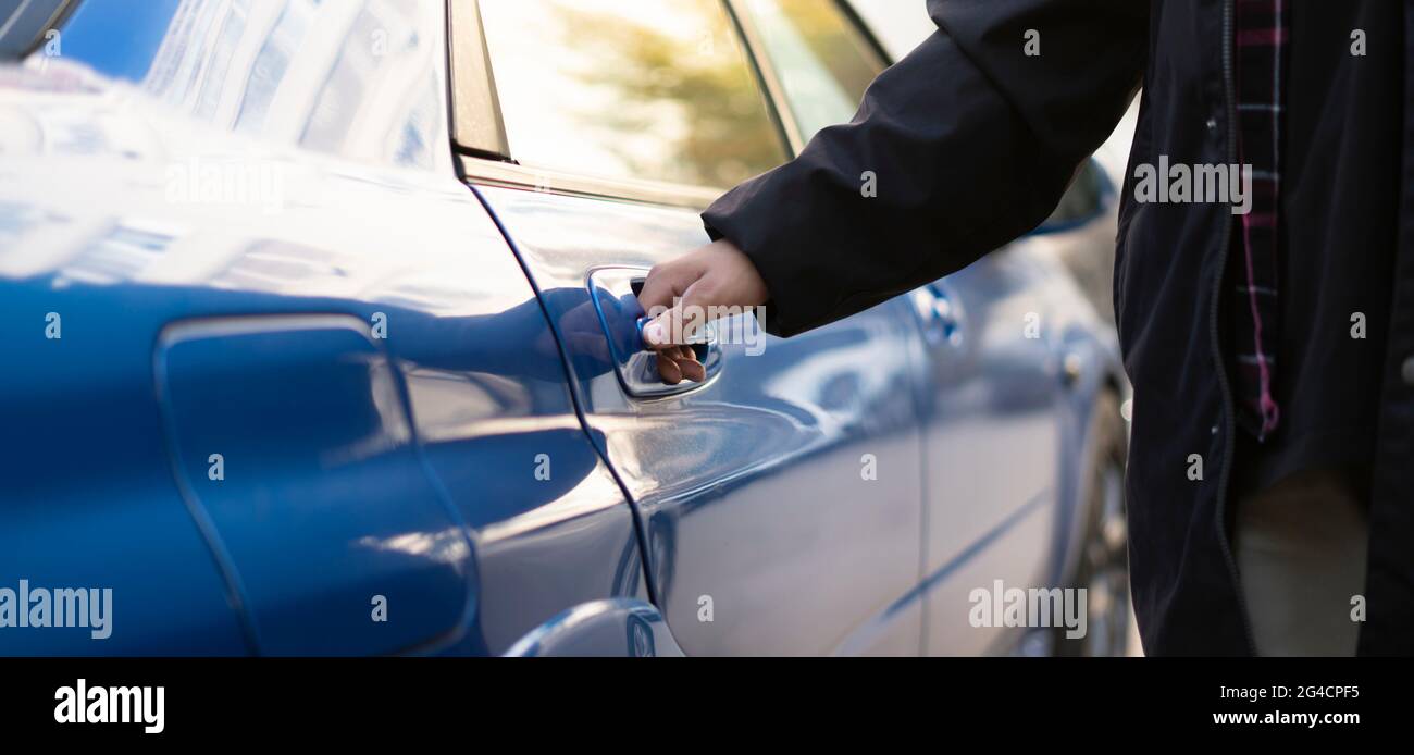 person open blue car door and sit inside, auto journey start Stock ...