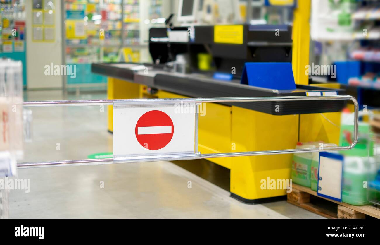 closed barrier, stop sign in the food grocery store supermarket ...