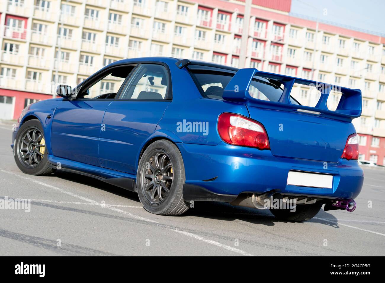 modern fast race sport blue car on the track on summer practice day Stock Photo - Alamy