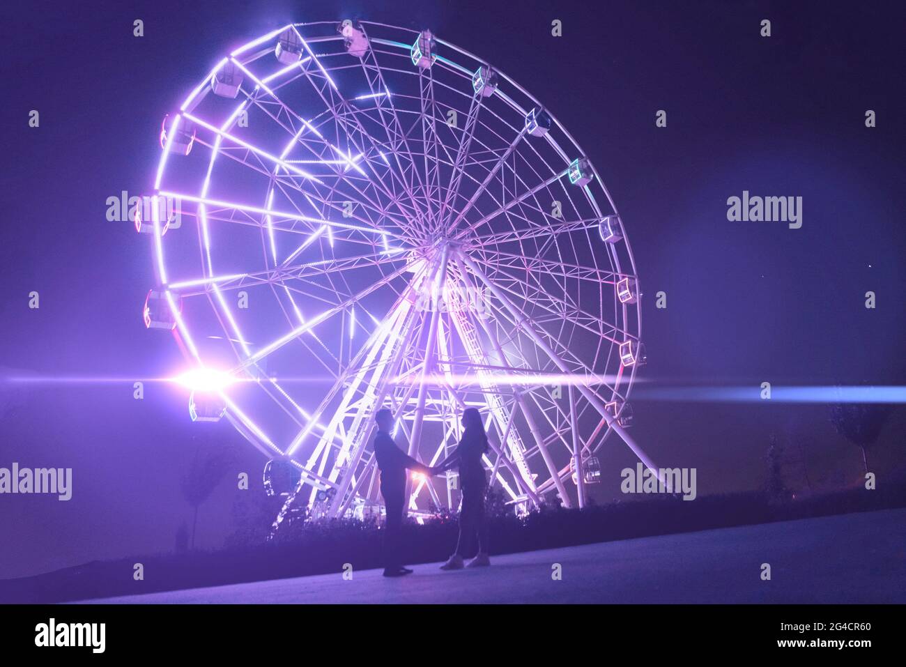 Romantic Ferris Wheels At Night
