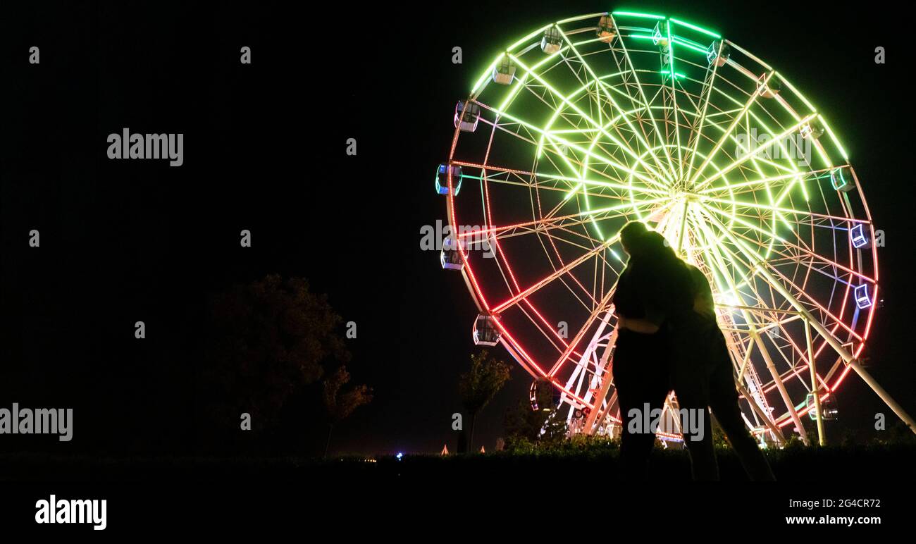 Romantic Ferris Wheels At Night