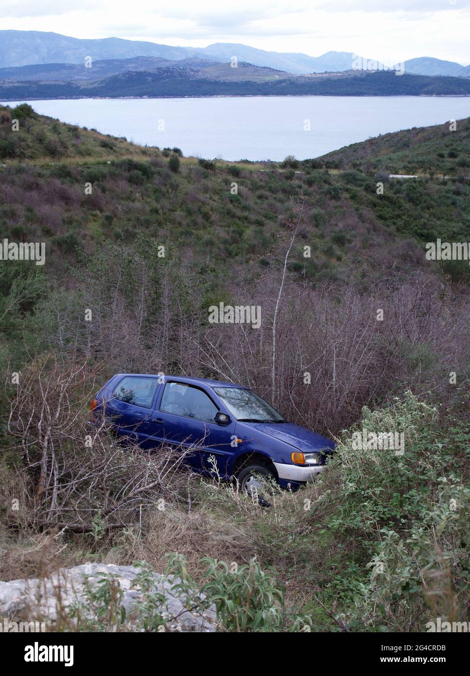Crashed VW polo car which has left the dangerous winding mountain road ...