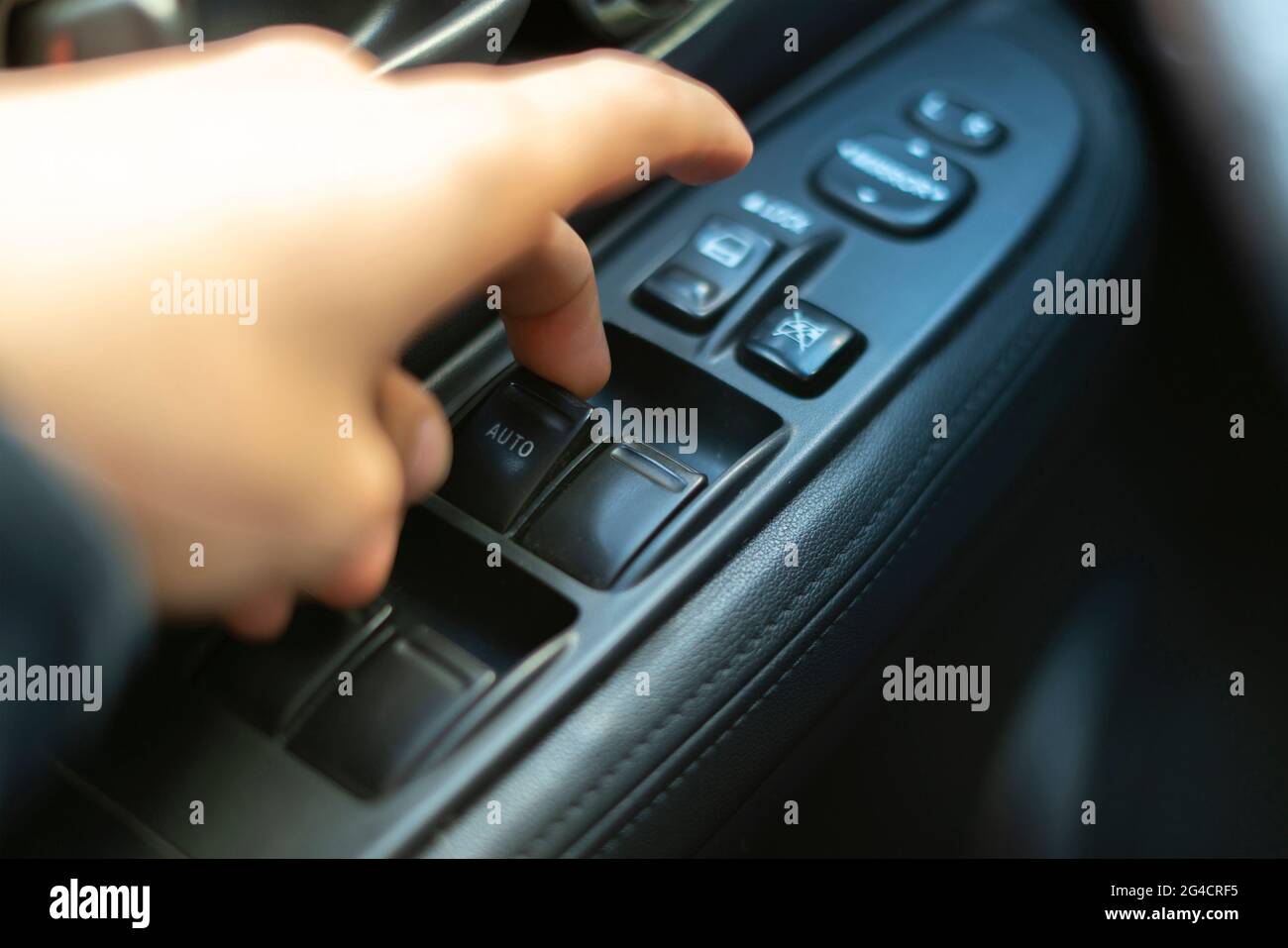 person sitting inside the car and open the window, finger push the ...