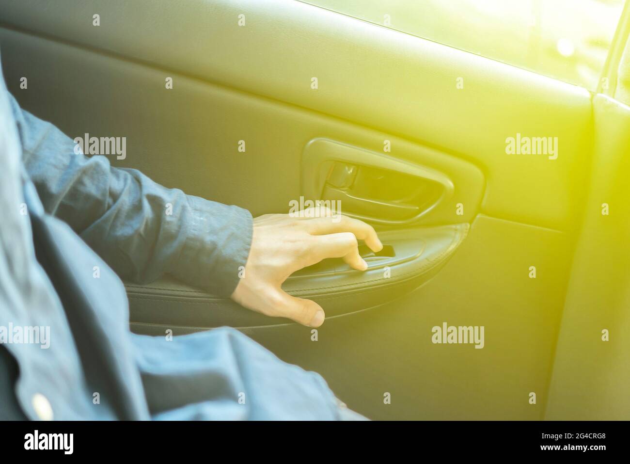 person sitting inside the car and open the window, finger push the ...