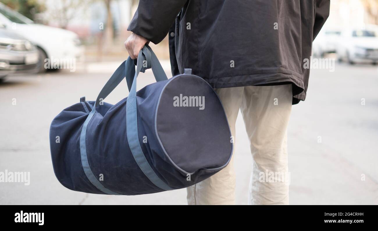 terrorist holding bag with bomb inside to put it in the public place in ...