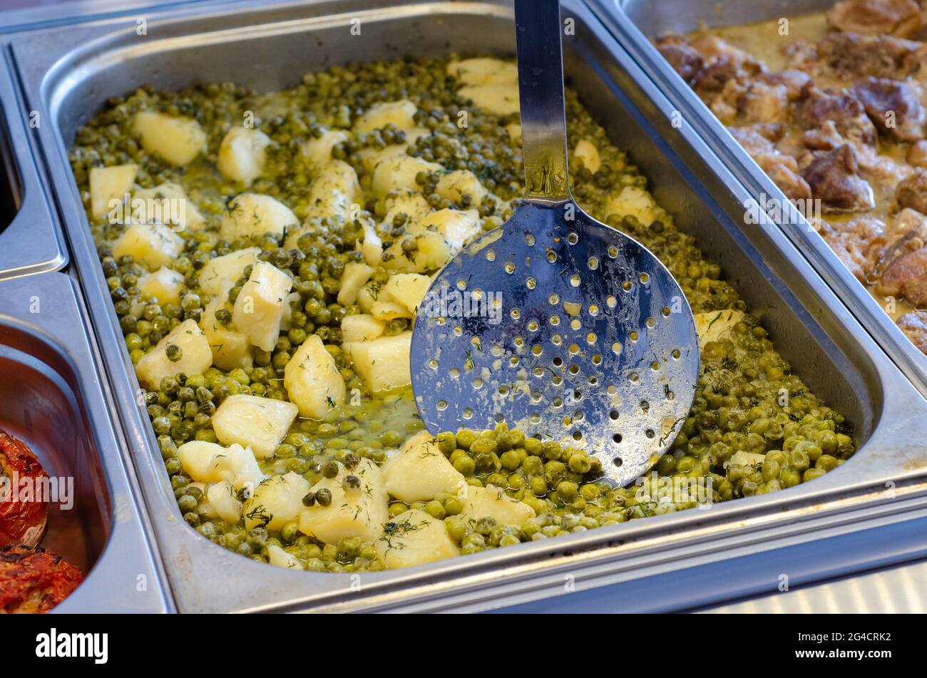 Metallic container with pea cuisine food Stock Photo - Alamy