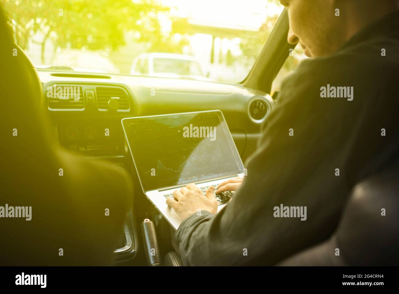 car mechanic doing auto diagnostic using computer, searching for check ...