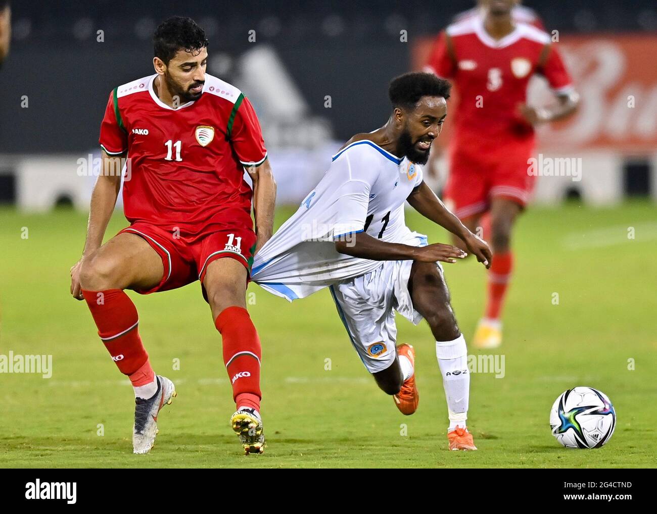 Doha, Qatar. 20th June, 2021. Muhsen Saleh Al Ghassani (L) of Oman vies ...