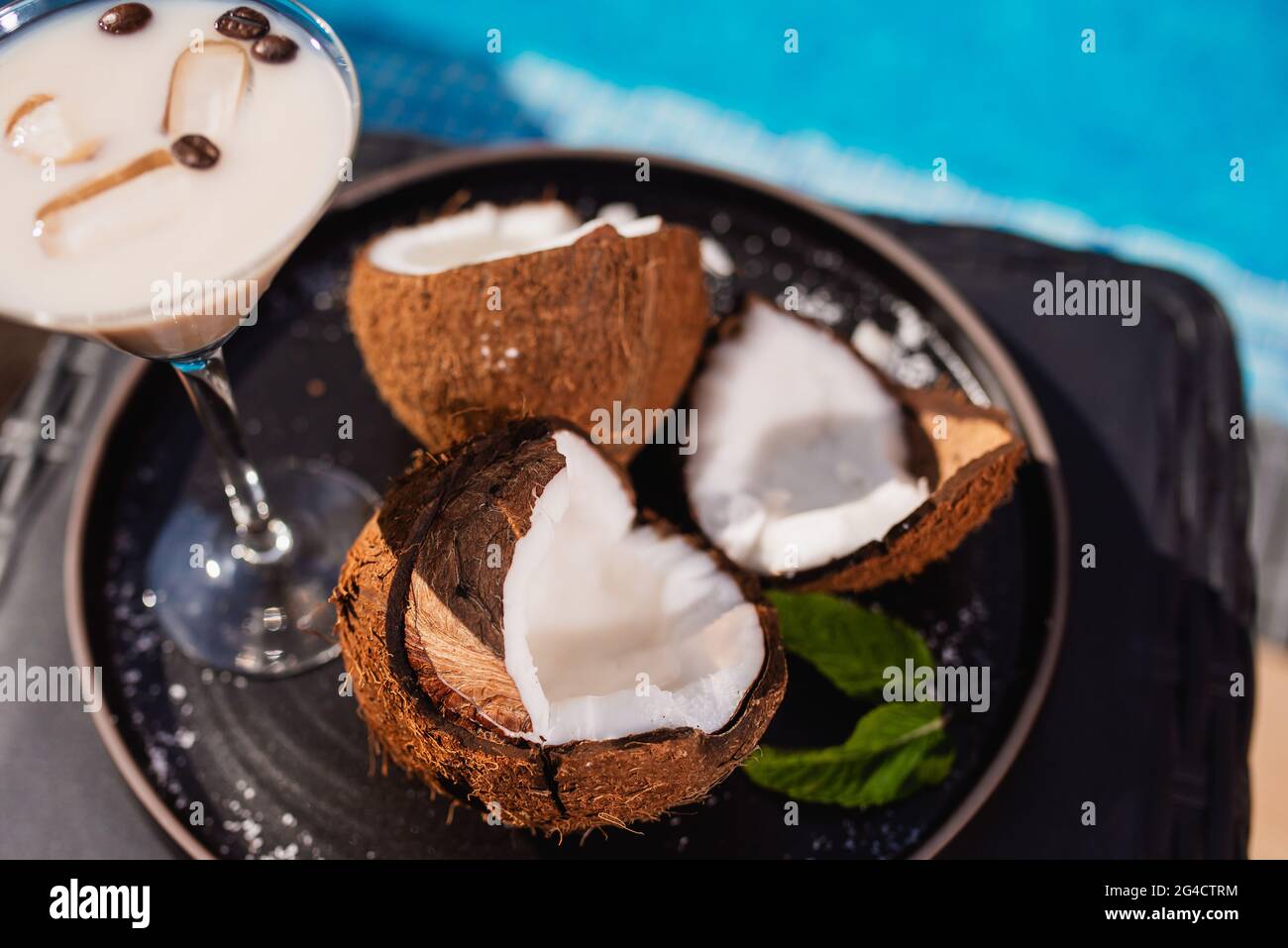 Top view of coffee in a cup with beans served on a tray next to the ...