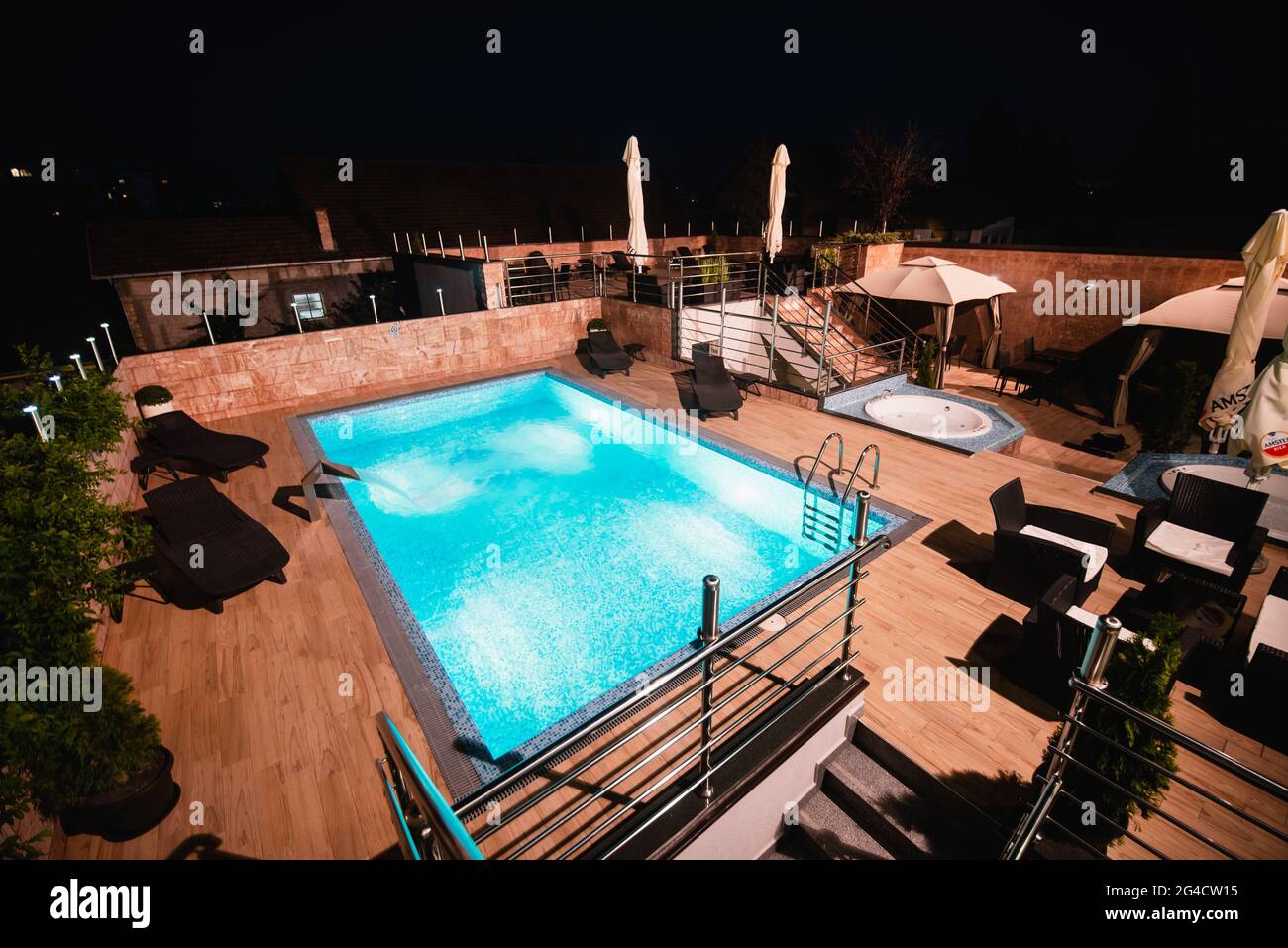 Large hotel pool at night Stock Photo - Alamy