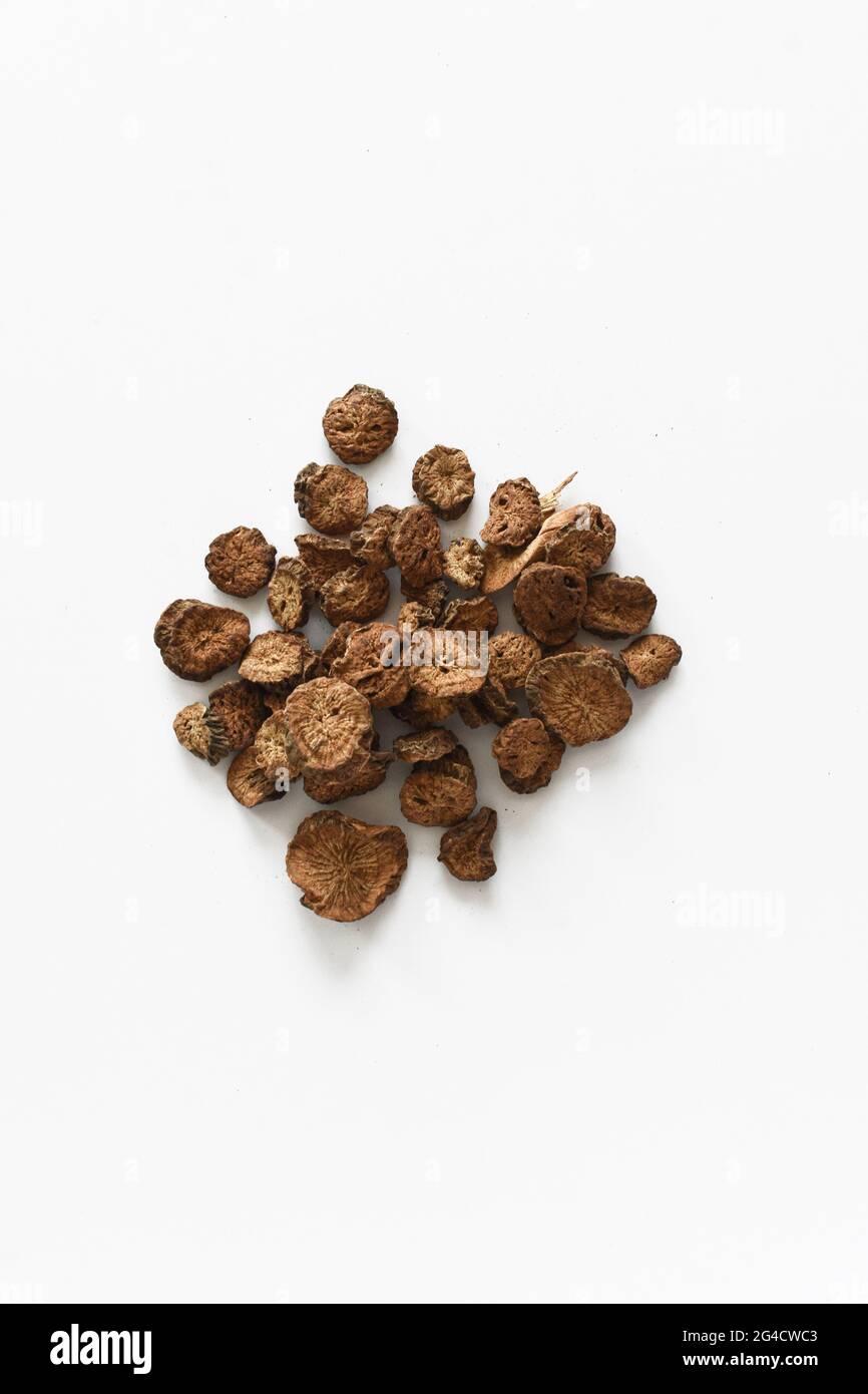 Dried burdock roots on isolated white background Stock Photo - Alamy