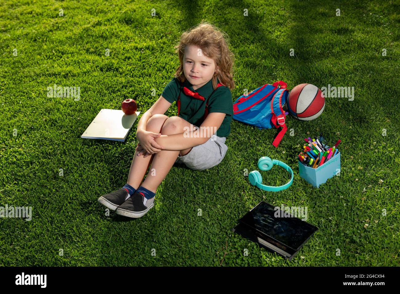 Kid studying online outdoor in park. Study in nature. Online school ...